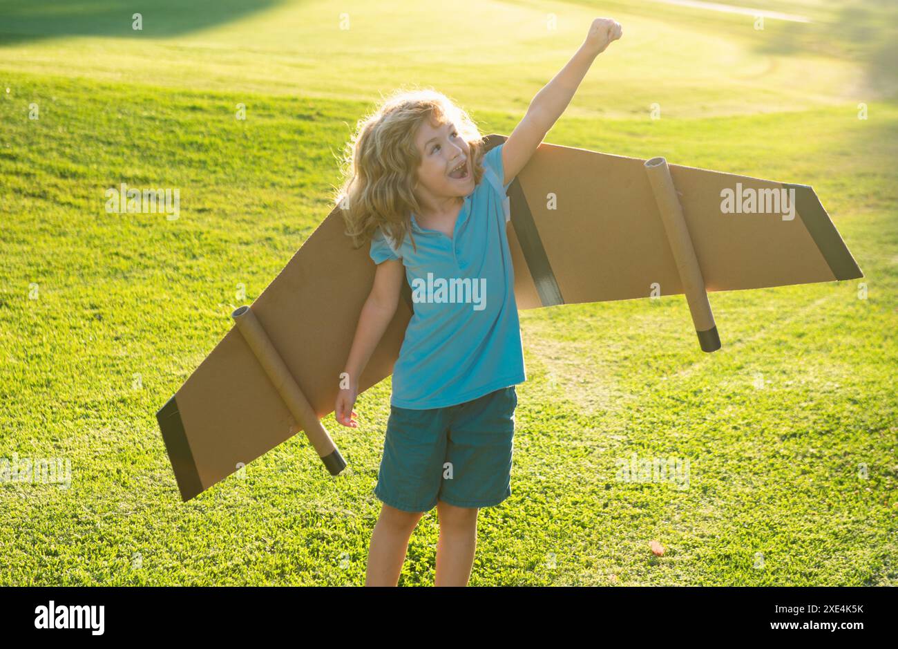 Kid superhero with jetpack. Child pilot play on summer day. Success ...