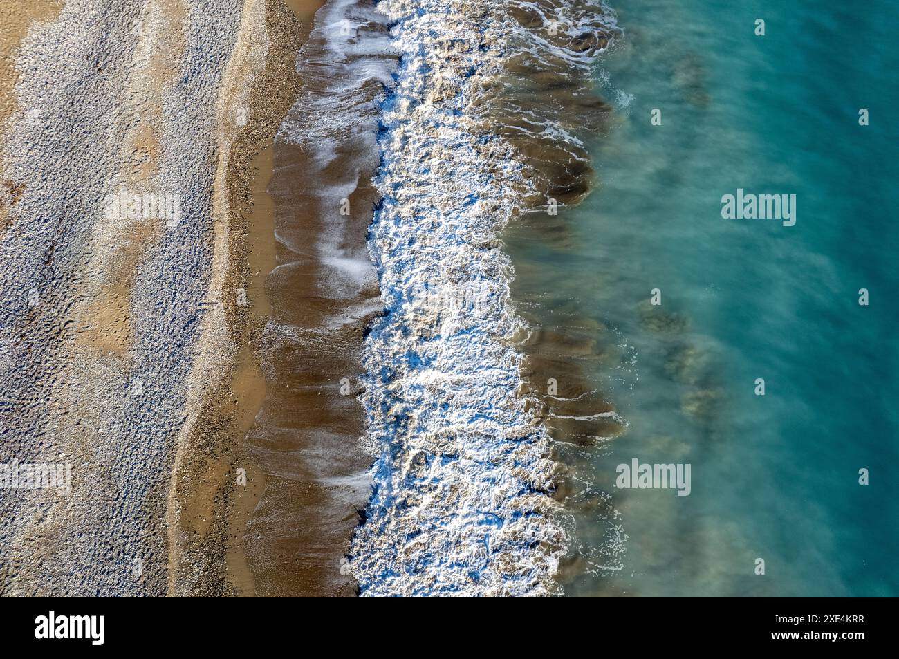 Aerial view of stormy ocean waves breaking on a beach. Nature ...