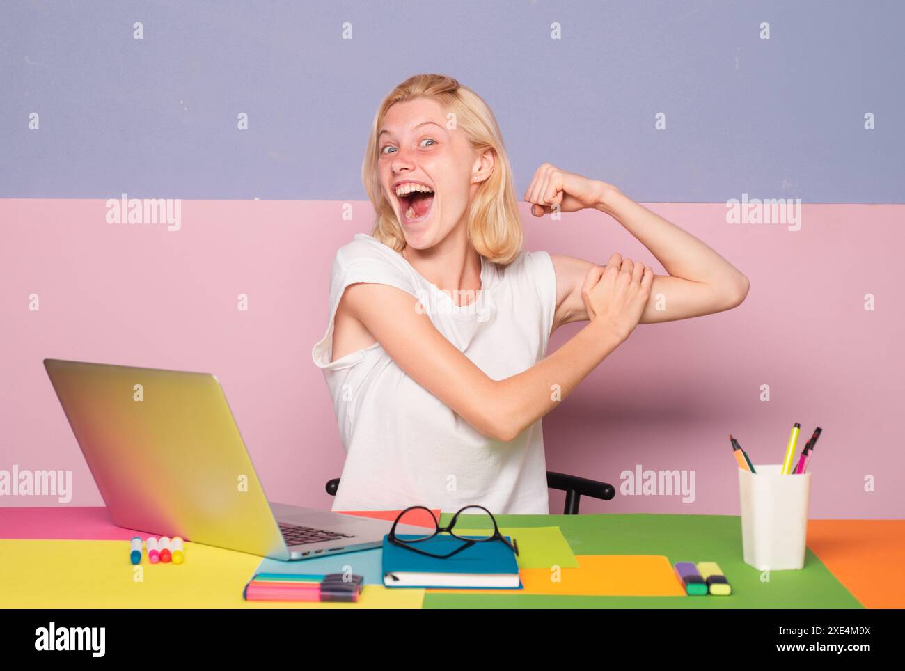 Excited amazed teacher shows muscles, woman power. Portrait of funny ...