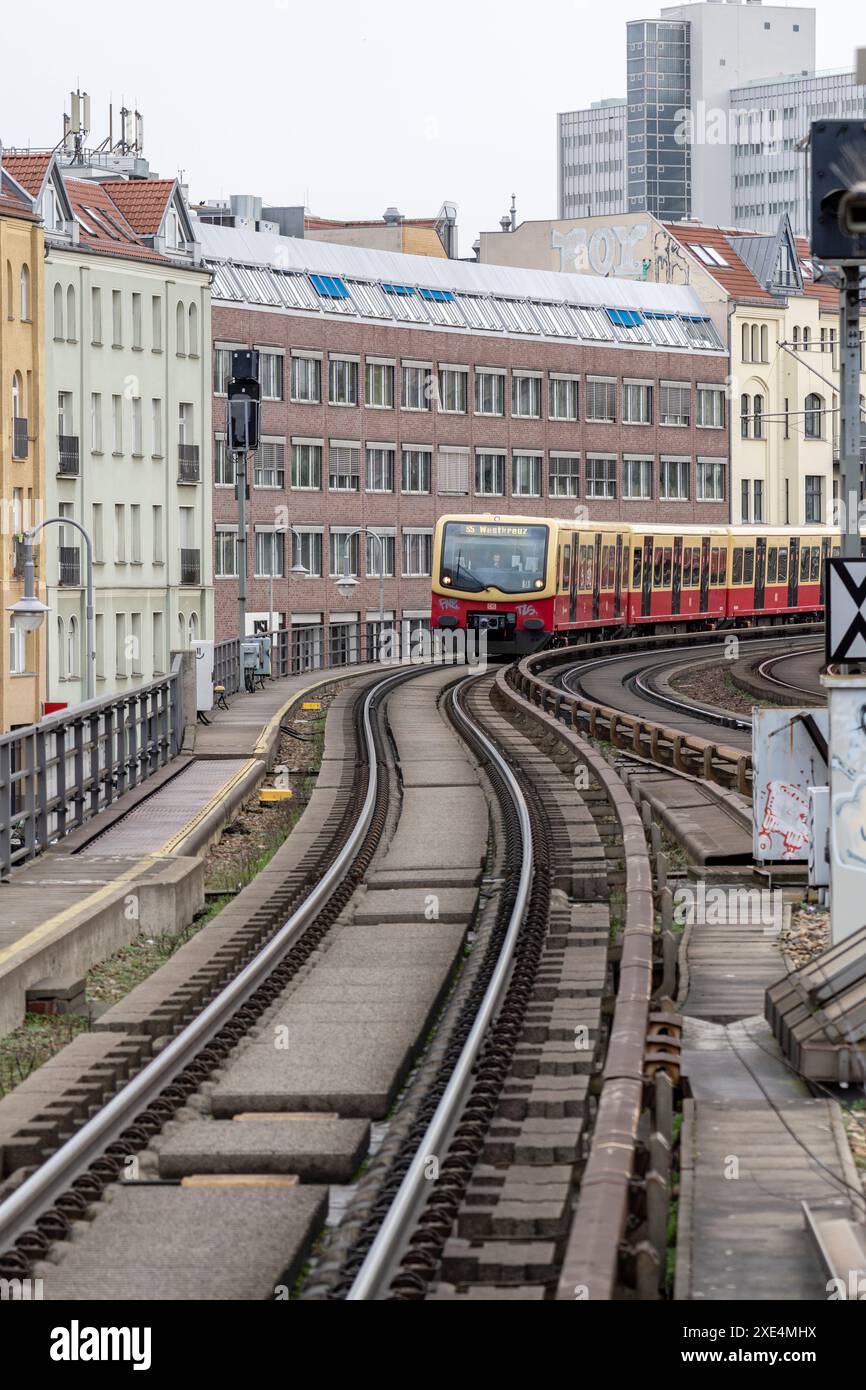 Metropolitan railway between houses of suburbs Stock Photo - Alamy