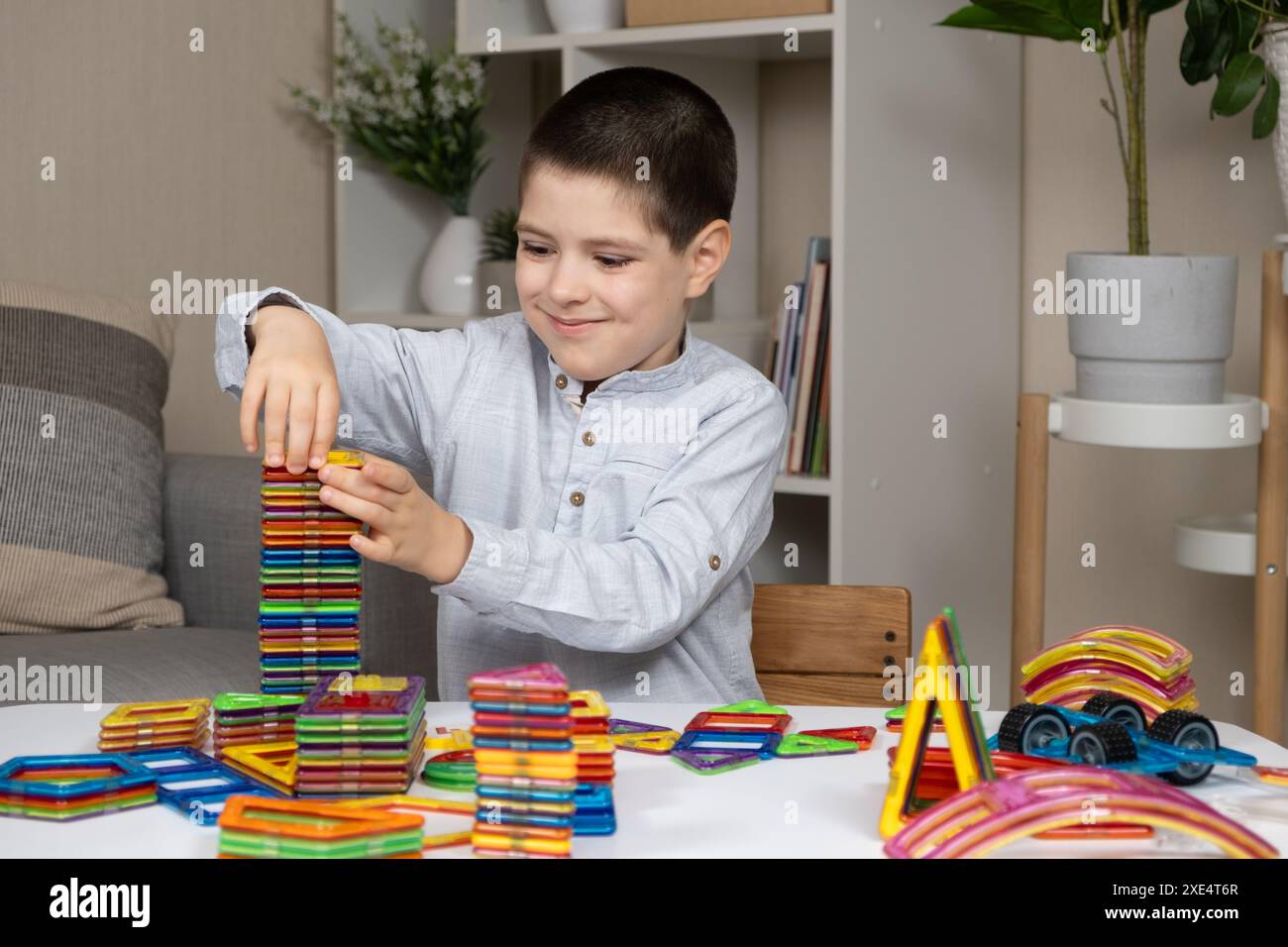 Boy building tower from magnetic hi-res stock photography and images ...