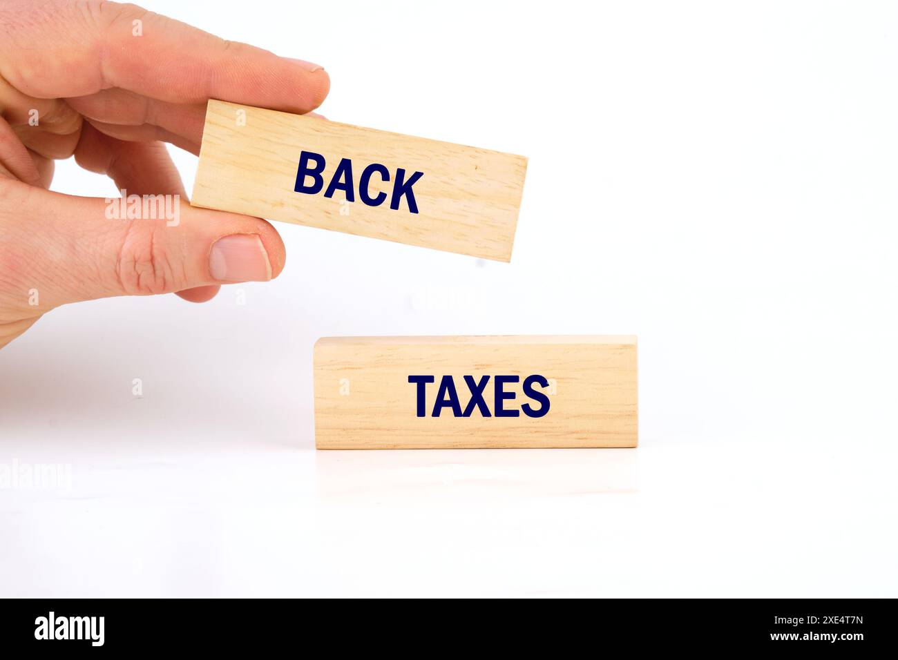 Business and back taxes concept. BACK TAXES symbol on wooden blocks ...