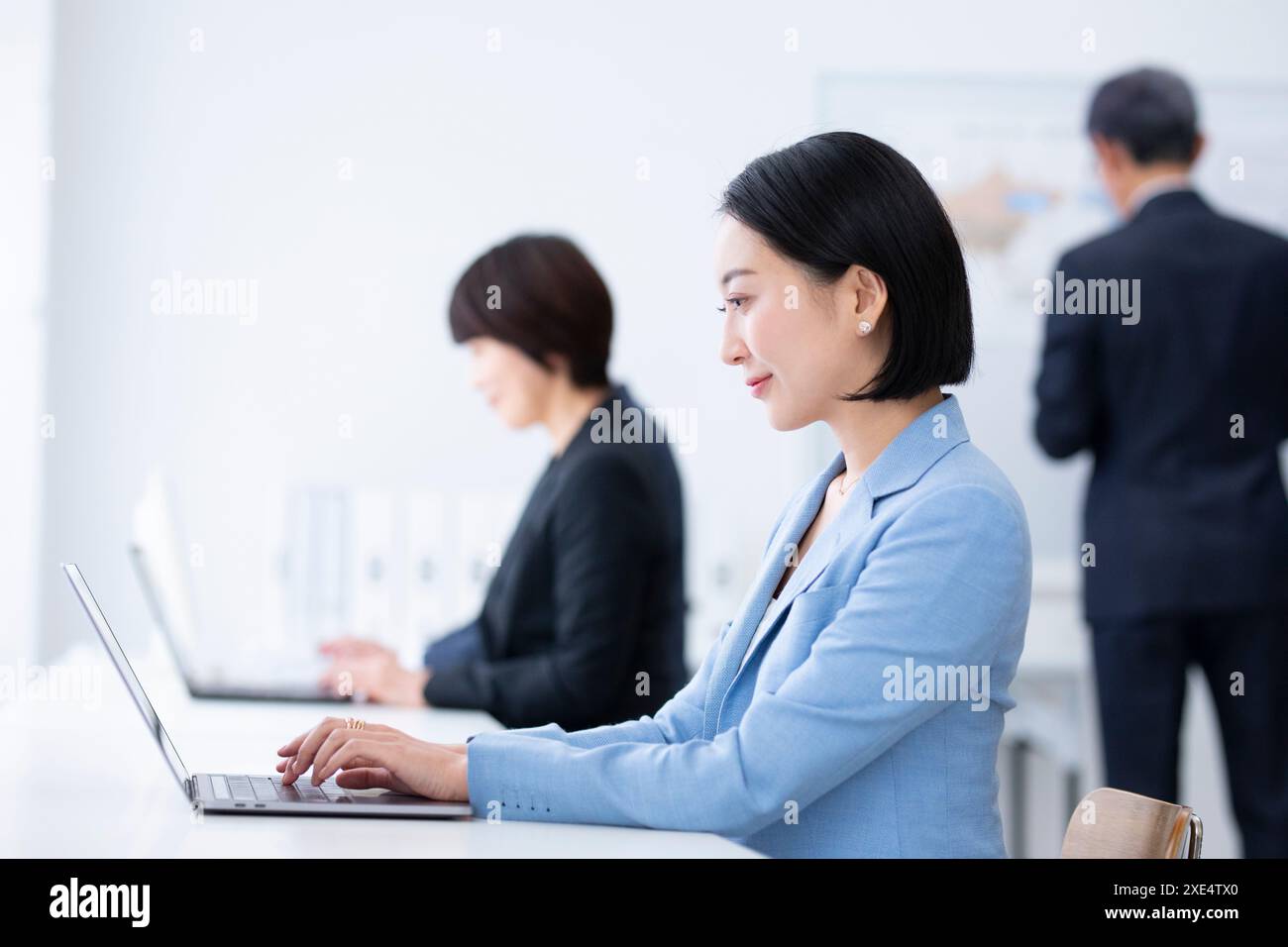 Woman work suit computer desk hi-res stock photography and images - Alamy