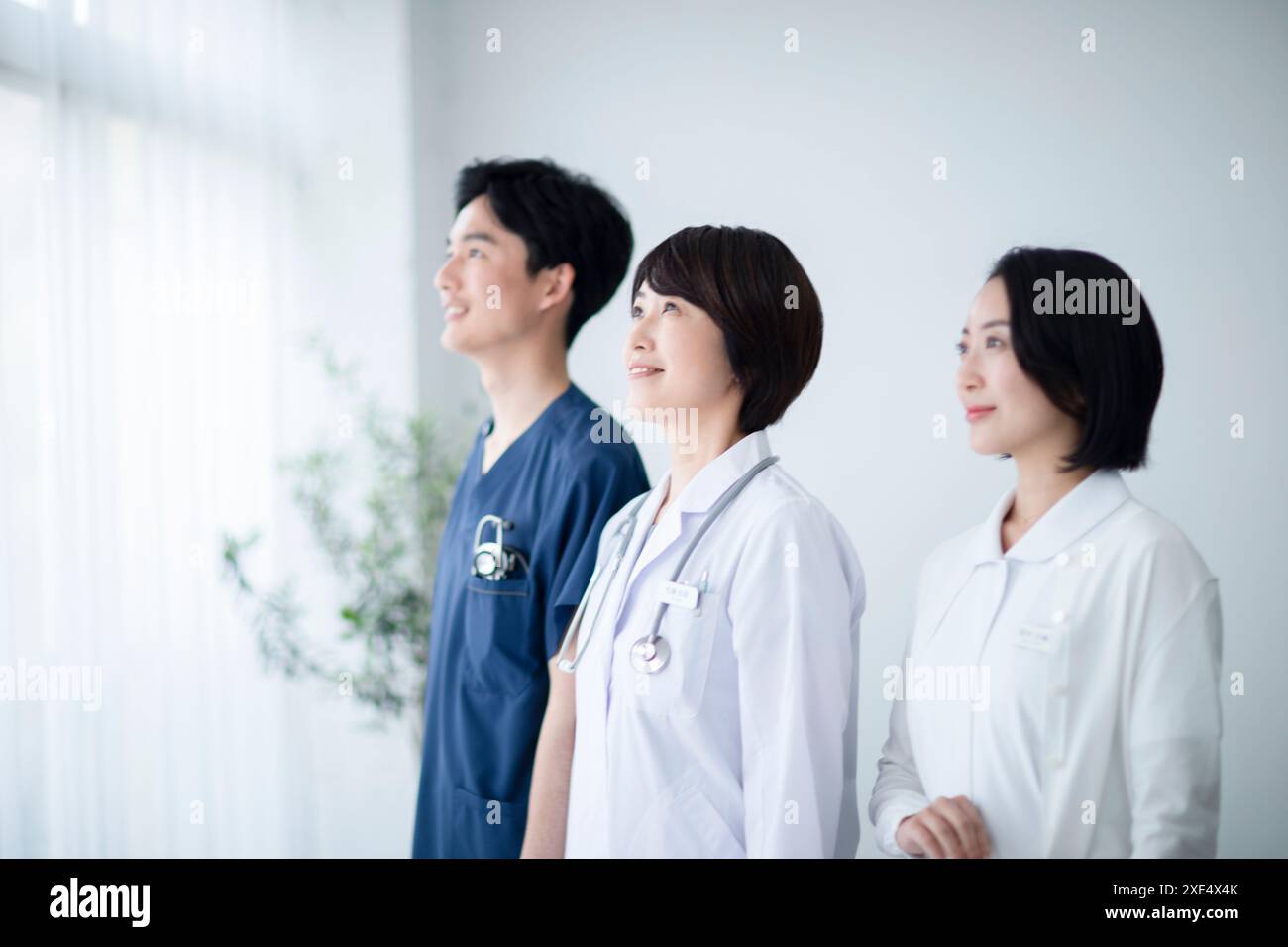 Doctors staring into the distance Stock Photo - Alamy