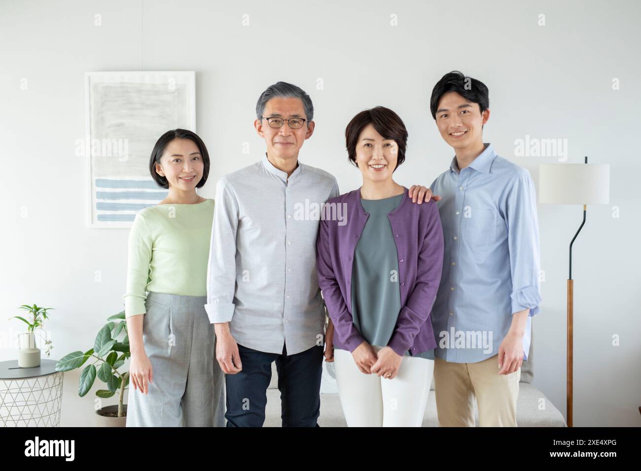 Family of two generations smiling Stock Photo - Alamy