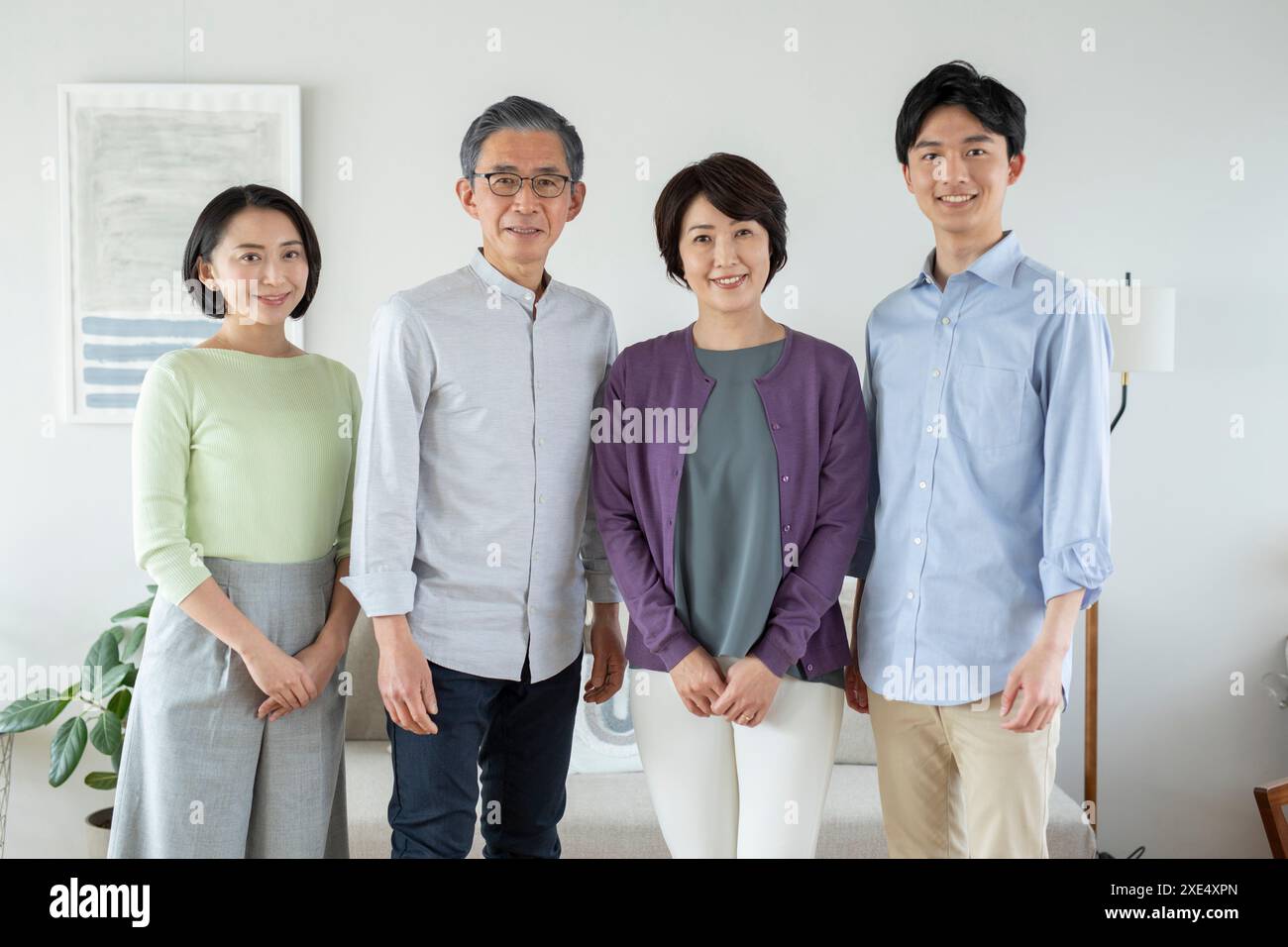 Family of two generations smiling Stock Photo - Alamy