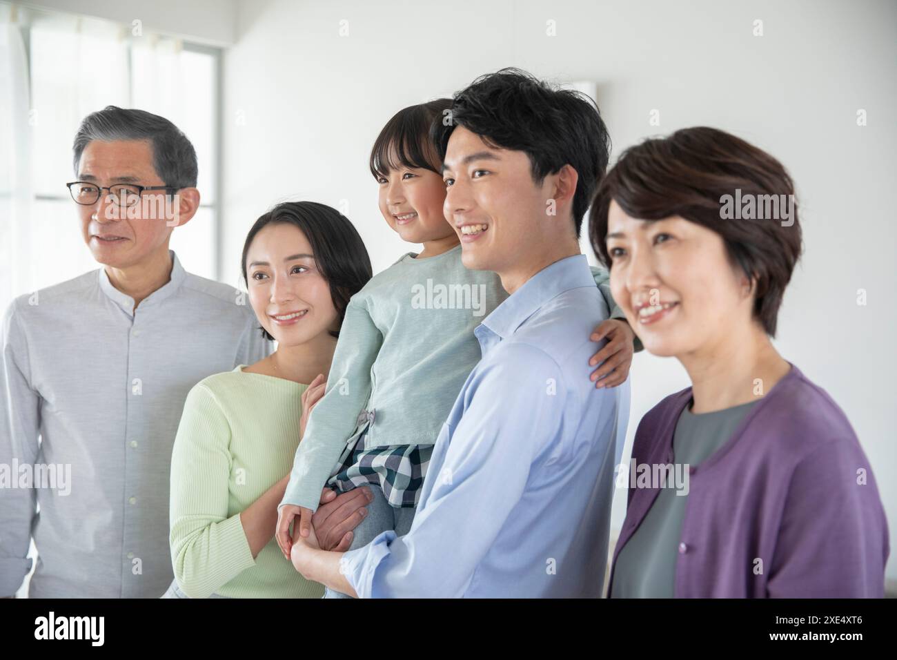 Smiling three-generation family Stock Photo - Alamy