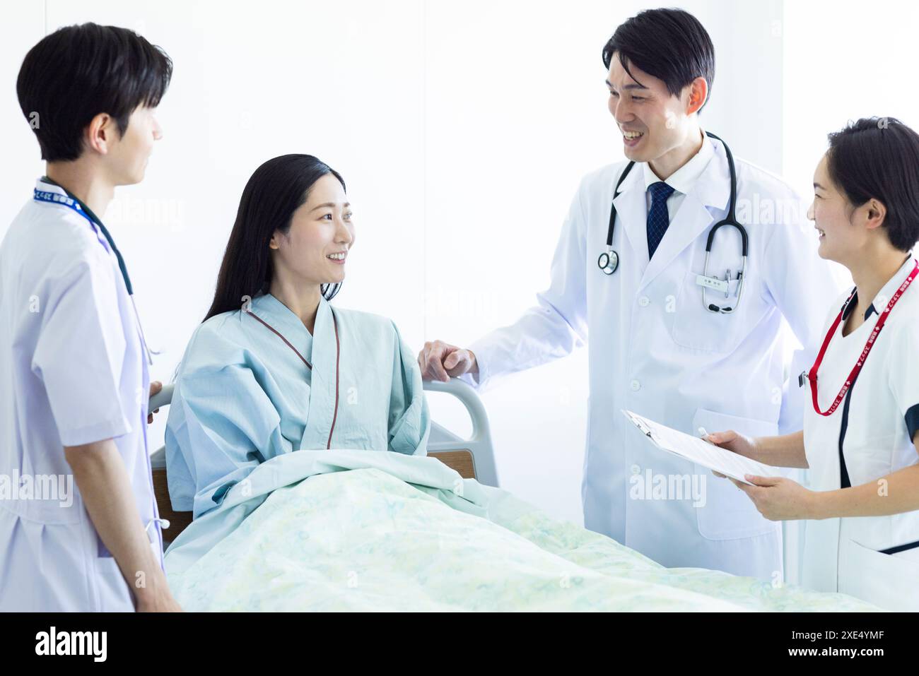 Medical team and patient Stock Photo - Alamy
