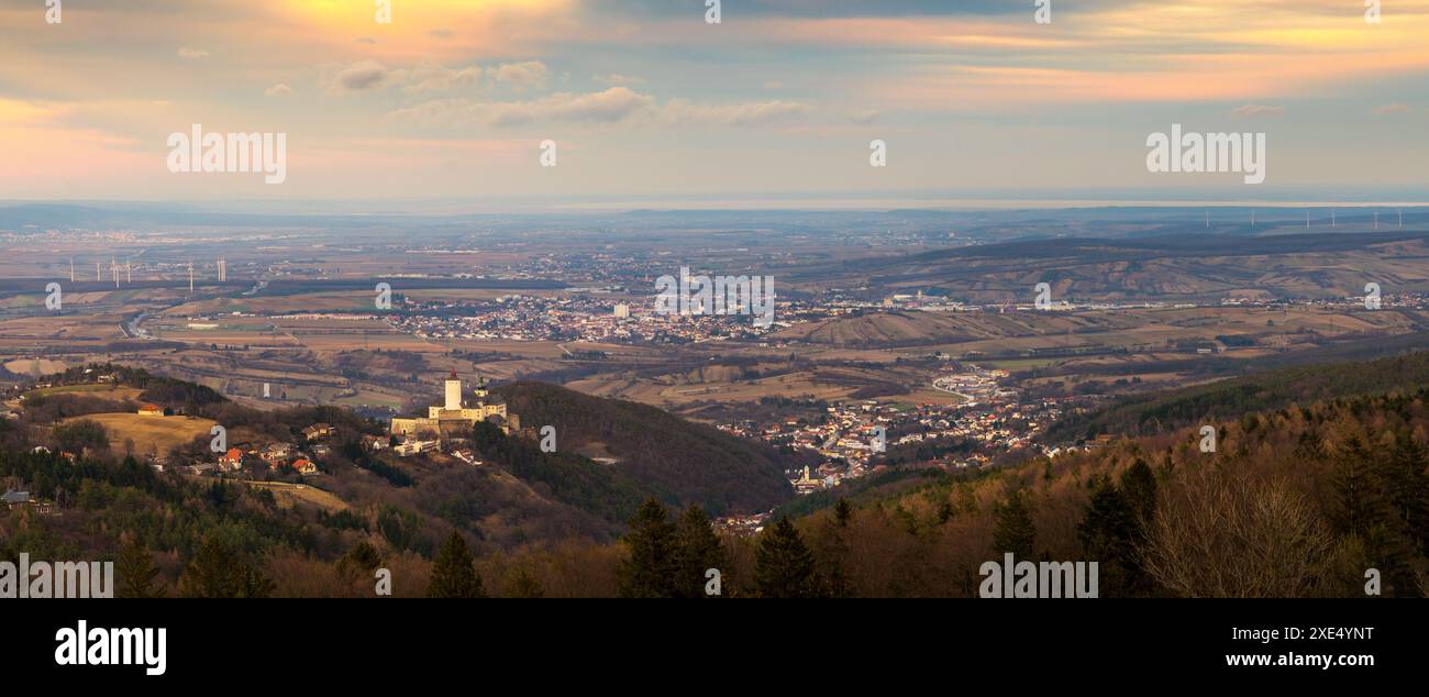 The medieval Forchtenstein Castle on the hilltop surrounded by dense ...