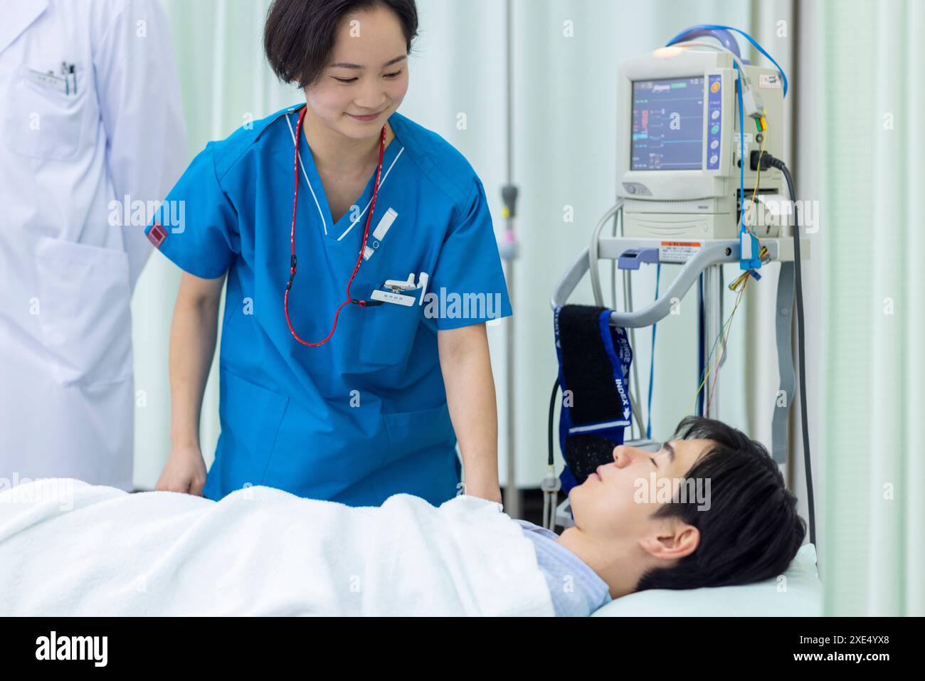 Nurse taking an ECG Stock Photo - Alamy