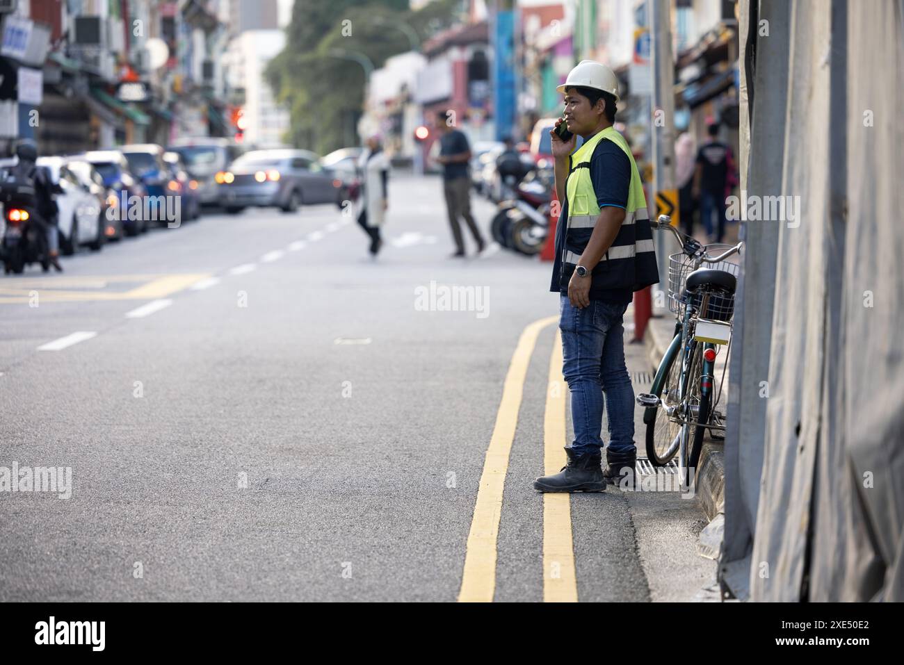 Singapore 05 may 2024: worker on the street in Singapore. High quality ...