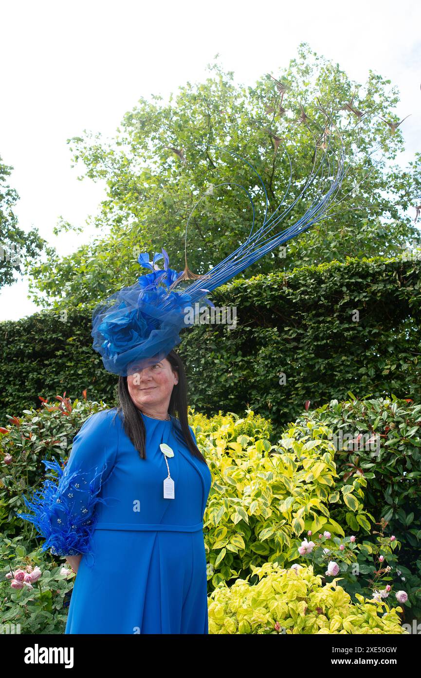 Ascot, UK. 22nd June, 2024. Ascot Milliner Alison Tod wears one of her ...