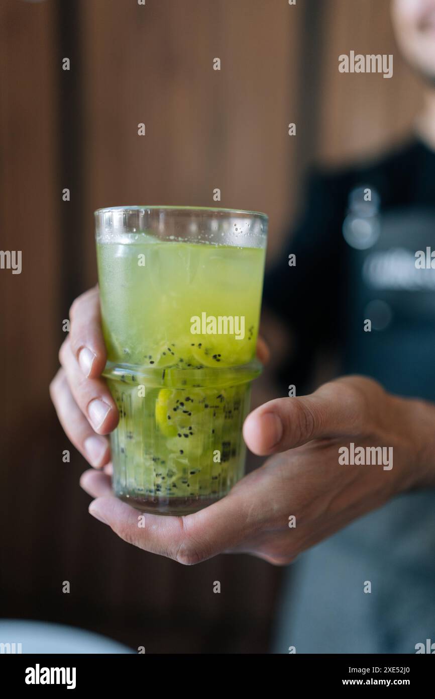Close-up vertical cropped shot of unrecognizable professional bartender ...