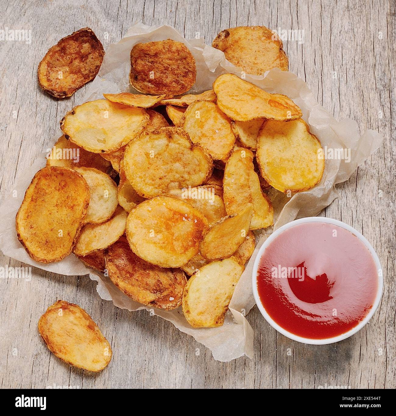 Chips with tomatoes sauce on wooden backgrounds . Potato chips Stock ...