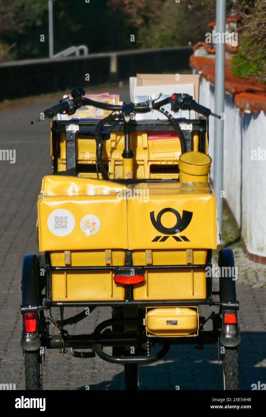 Mail delivery by e-bike Stock Photo - Alamy