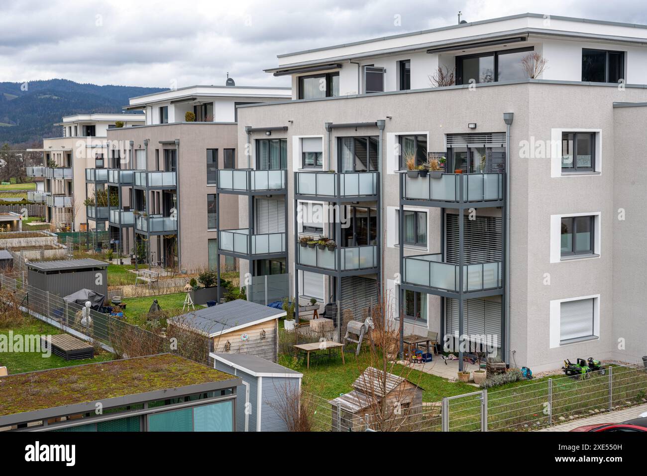 New gray apartment buildings in a housing development area in Germany ...