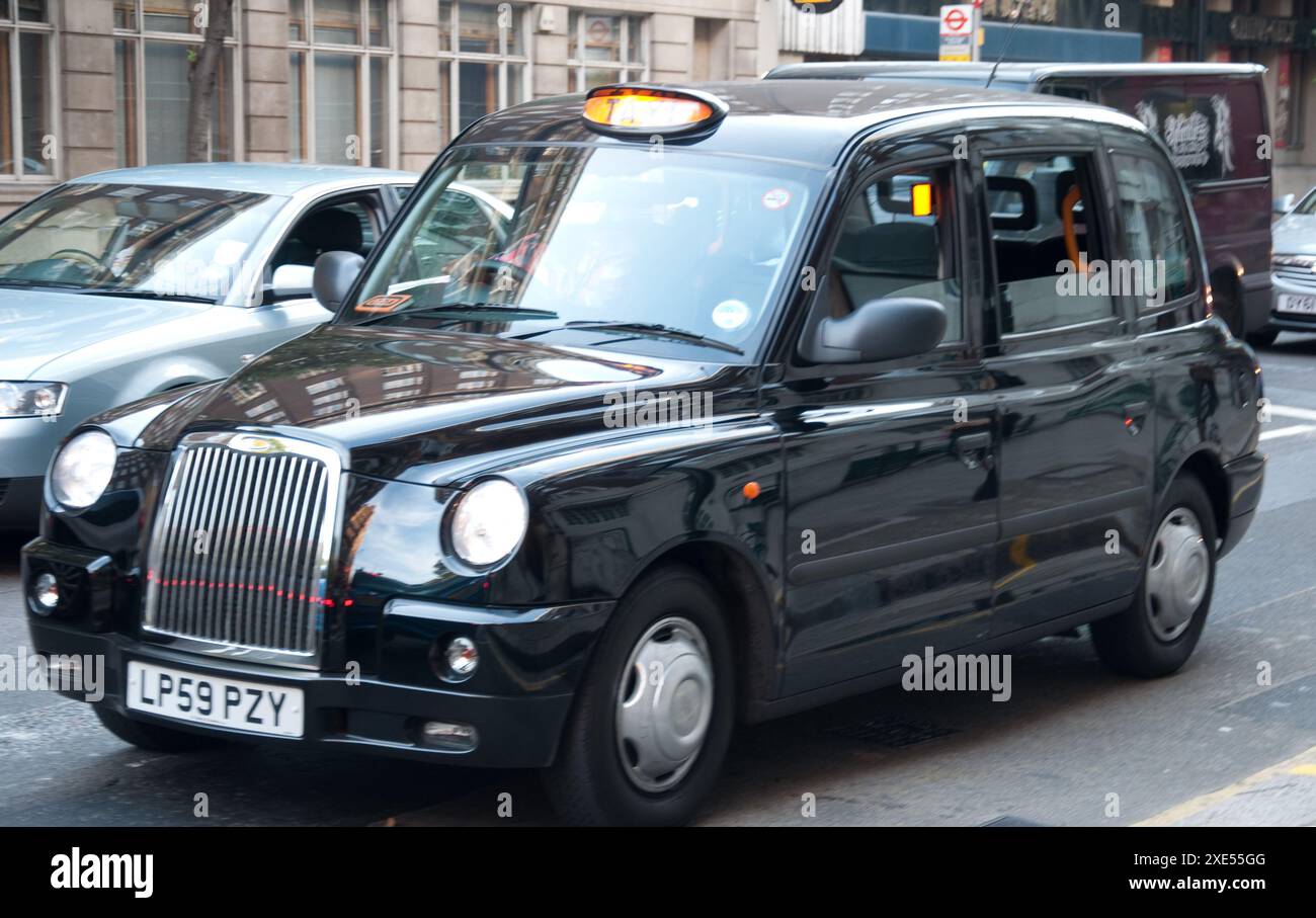 Traditional London taxi (black cab) on Woburn Place, Bloomsbury, London ...