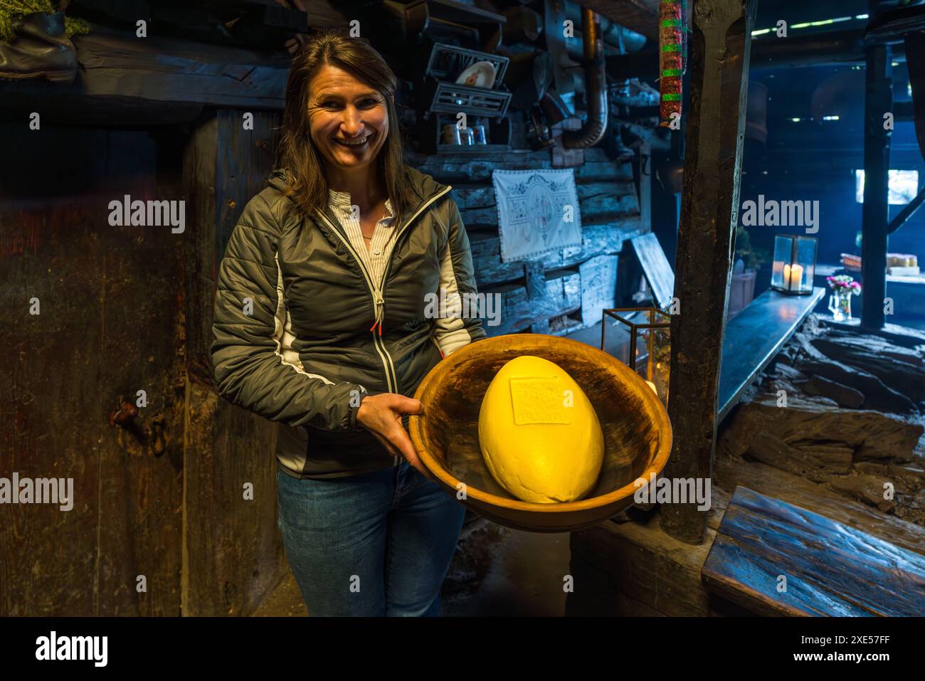Alpine landlady and farmer Helga Gruber from the Karseggalm shows off a ...