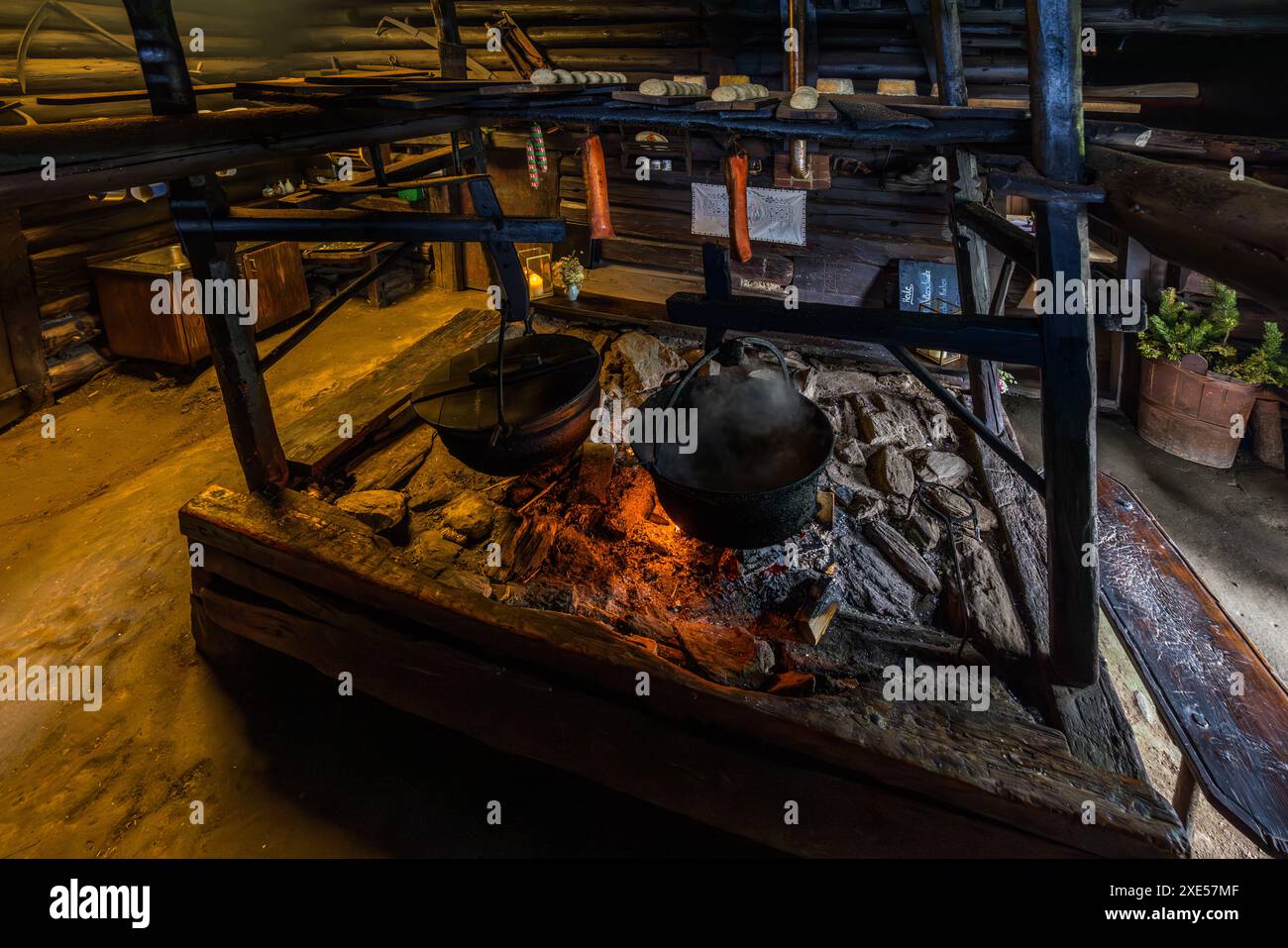 Cheese bubbles in a huge pot over the open fire at the Karseggalm and ...