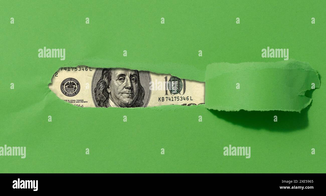 A green sheet of paper with a torn middle and a curled edge, a hundred ...