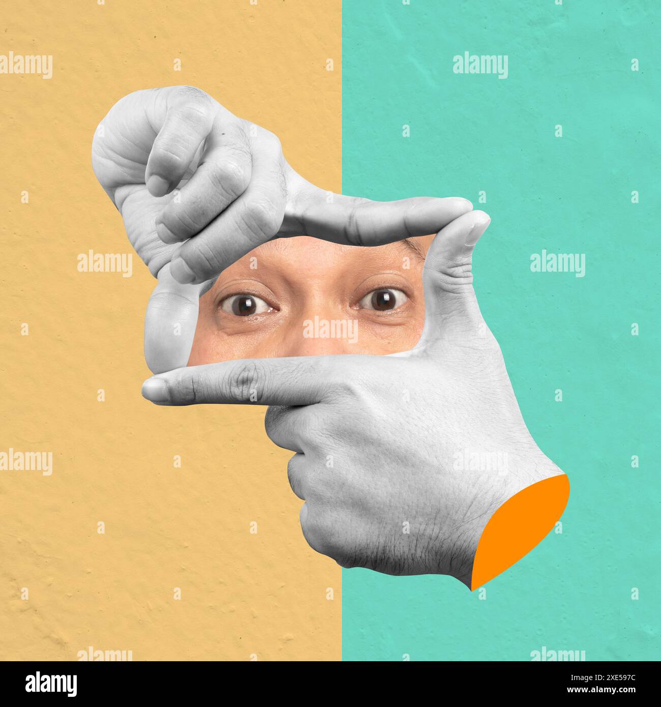 Human hand with hand camera gesture showing human eyes with a colored ...
