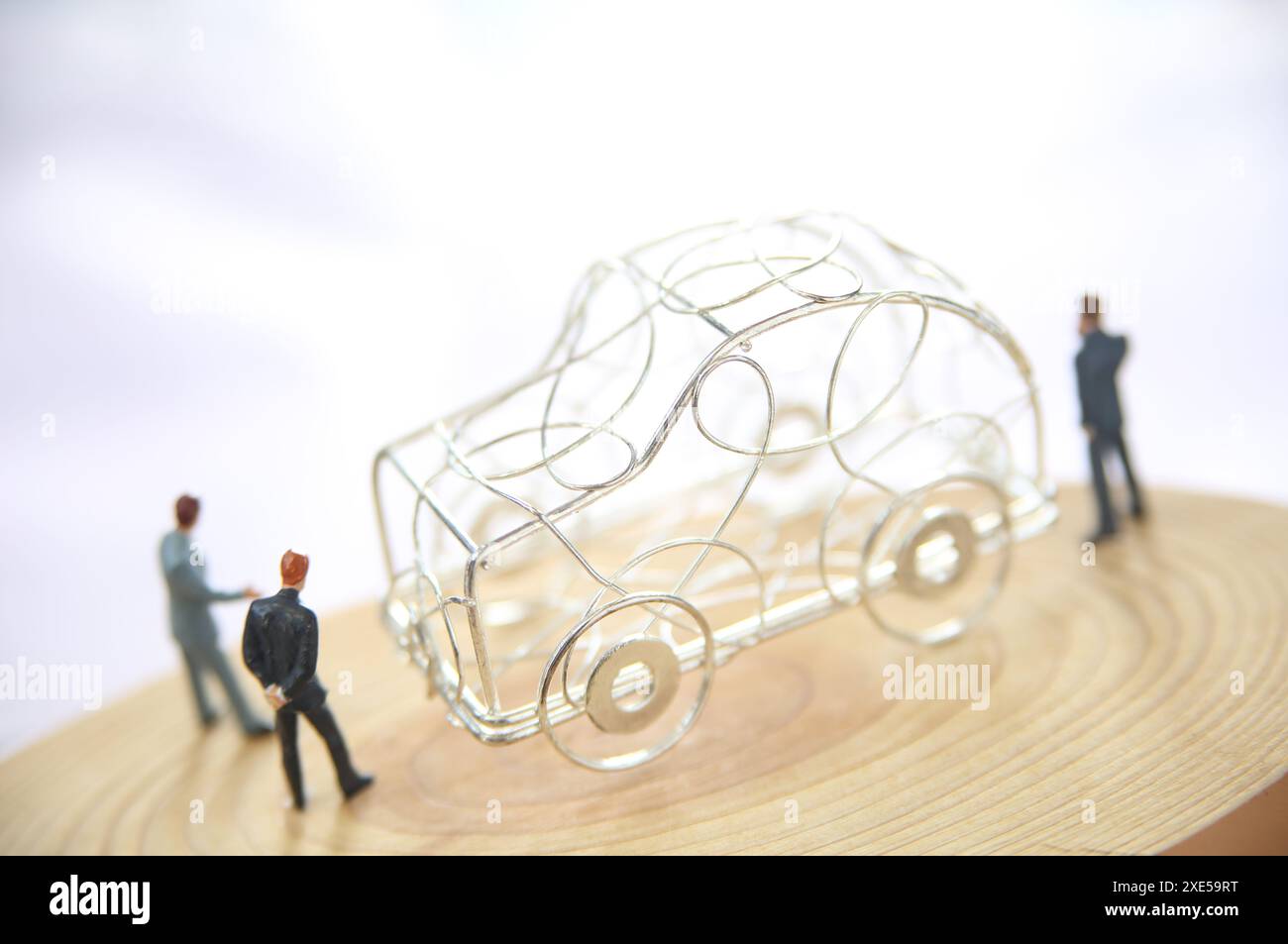 Wire car and miniature people Stock Photo - Alamy