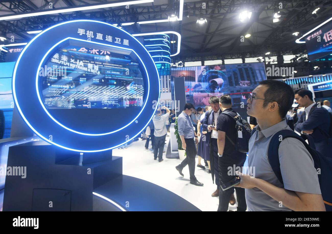 SHANGHAI, CHINA - JUNE 26, 2024 - Visitors check out direct satellite technology for Mobile ...