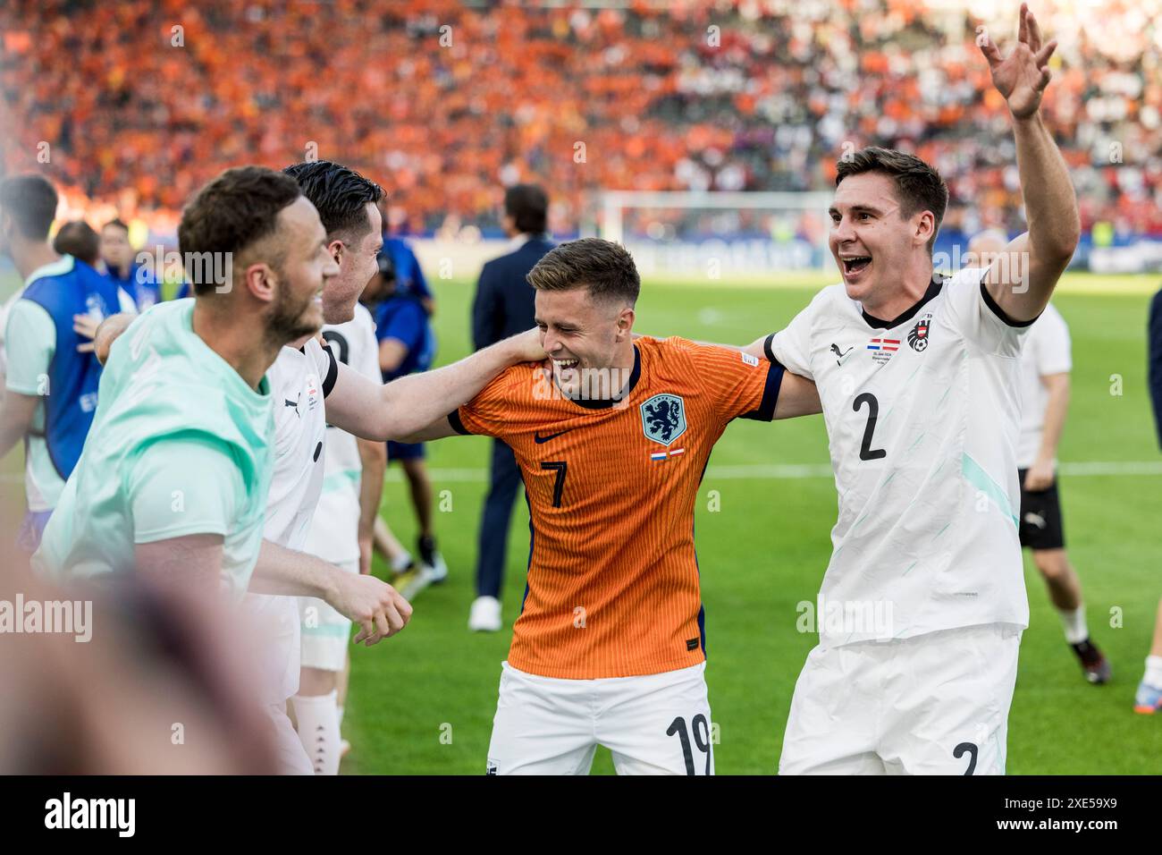 Berlin, Germany. 25th June, 2024. Christoph Baumgartner (19) and Maximilian Wöber (2) of Austria ...