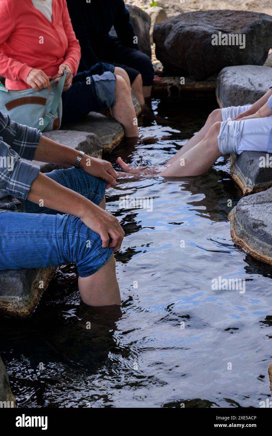 People soaking in a footbath Stock Photo - Alamy