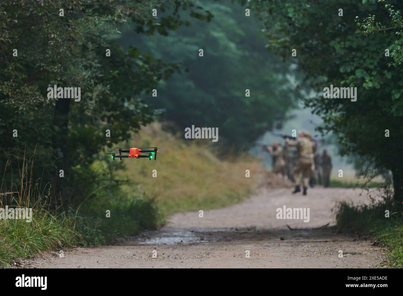 Elite military unit parading and securing the forest, utilizing drones ...