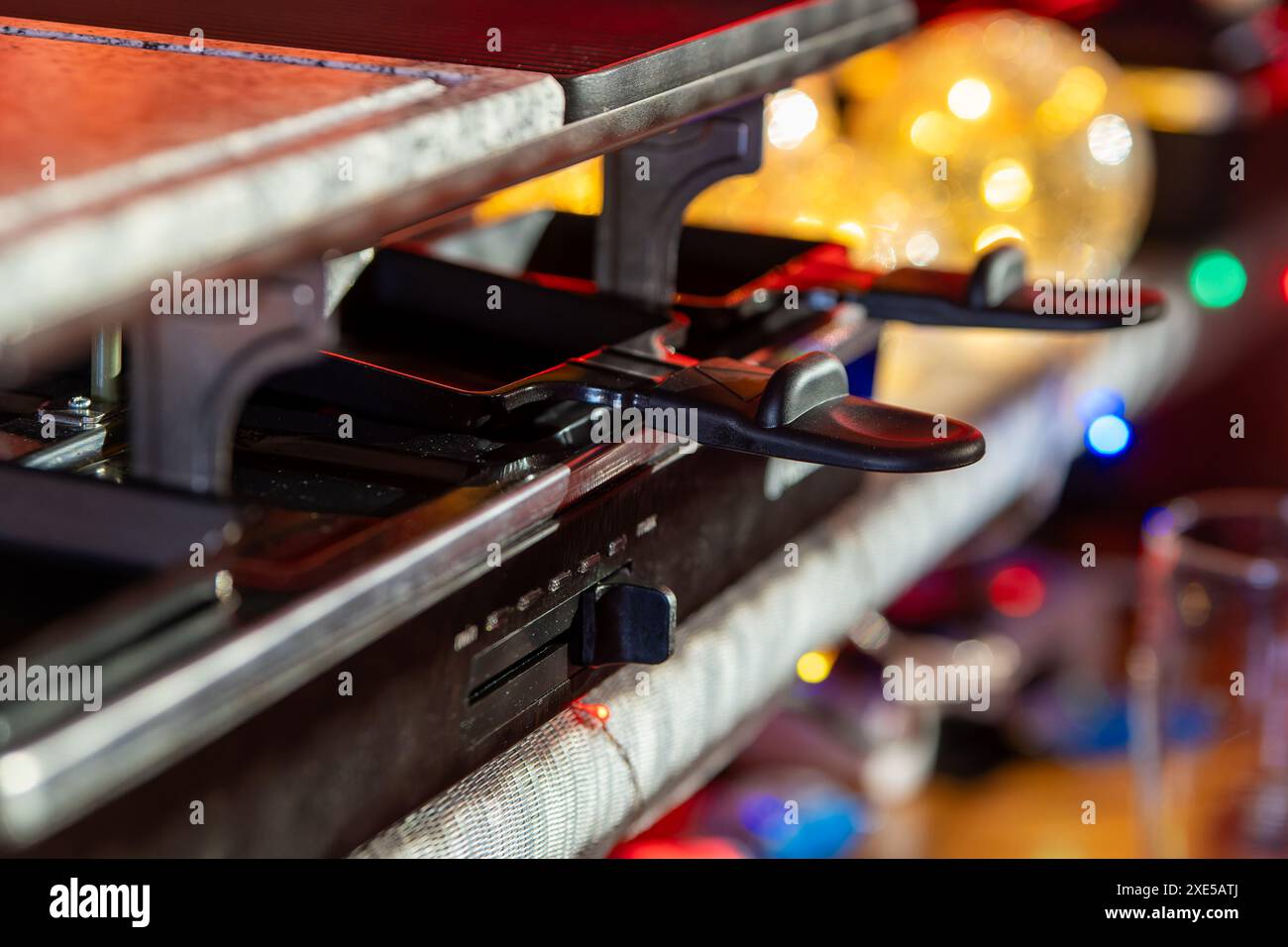 A raclette machine with a colourful background Stock Photo - Alamy