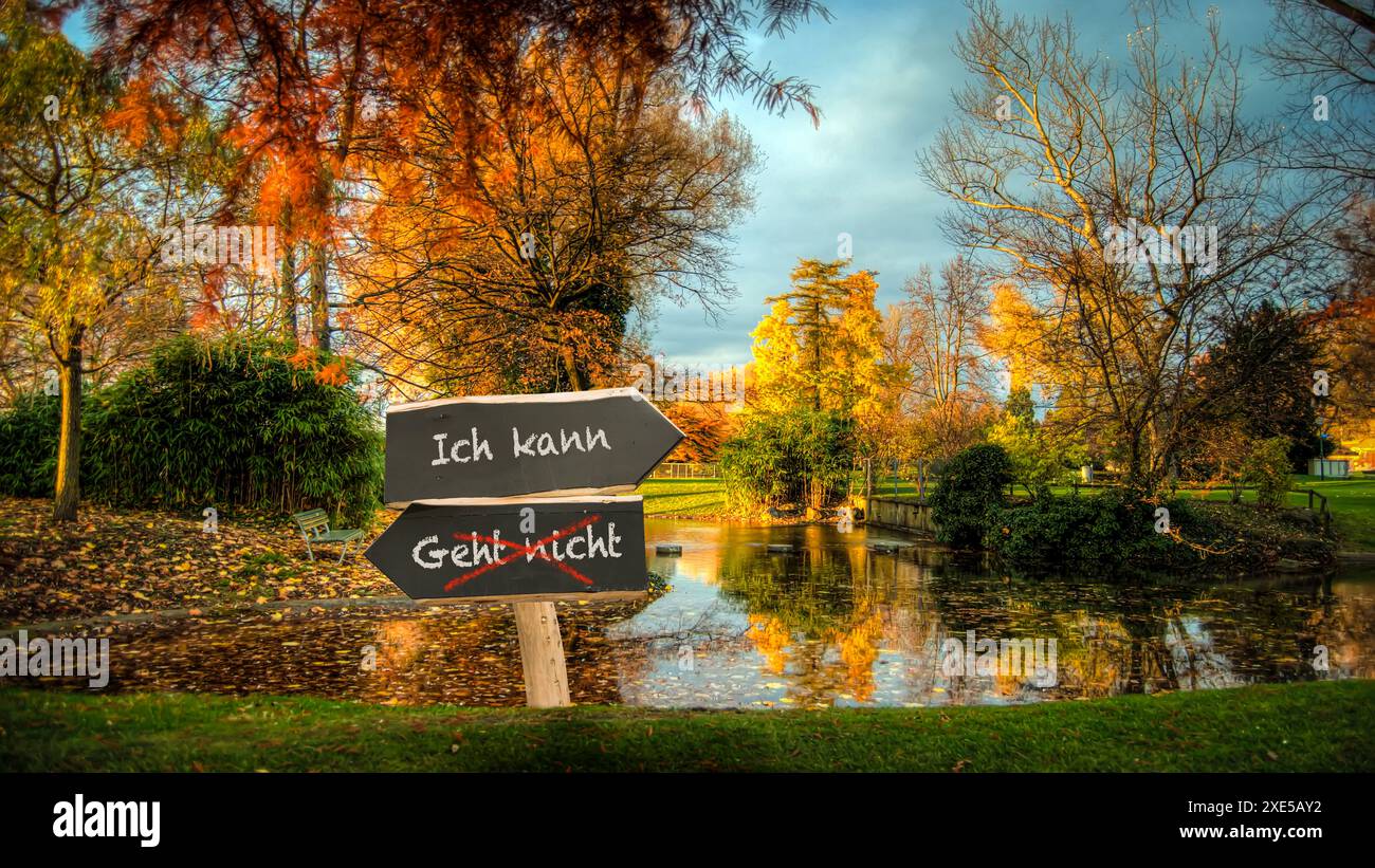 Signposts the direct way to I can versus resignation Stock Photo - Alamy