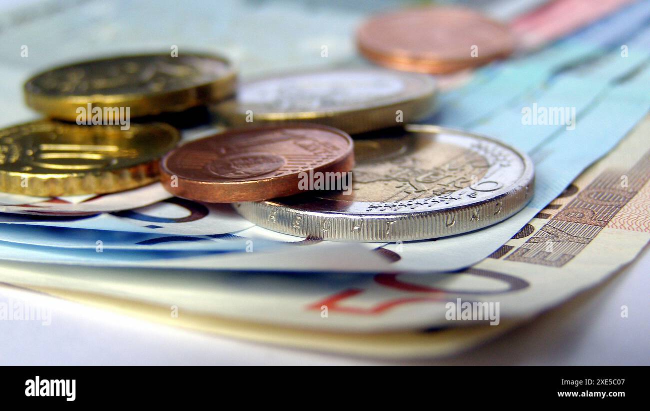 Euro notes and coins background Stock Photo - Alamy