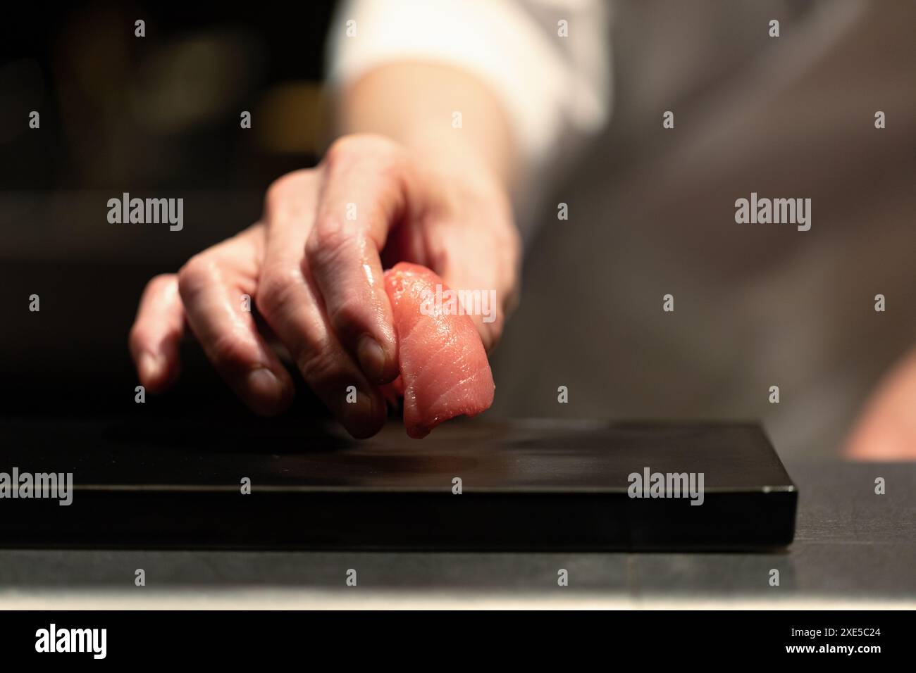 Sushi serving scene Stock Photo - Alamy
