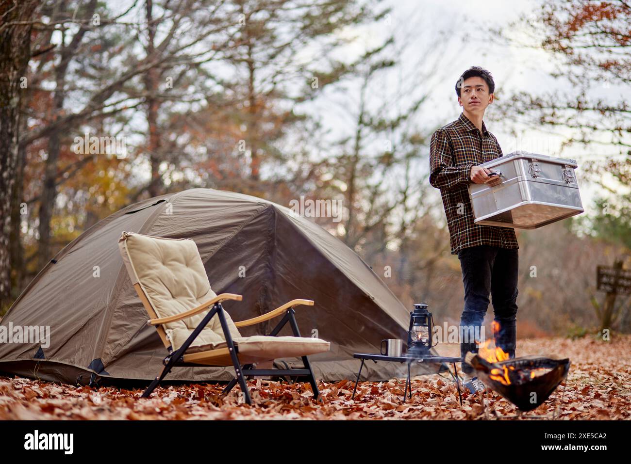 Young Japanese man enjoying solo camping Stock Photo - Alamy