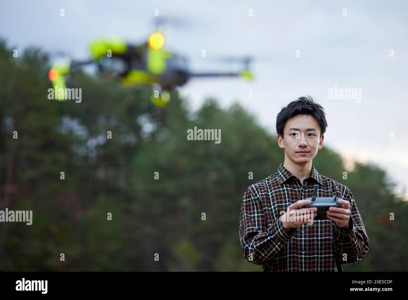 Young Japanese man operating a drone Stock Photo - Alamy