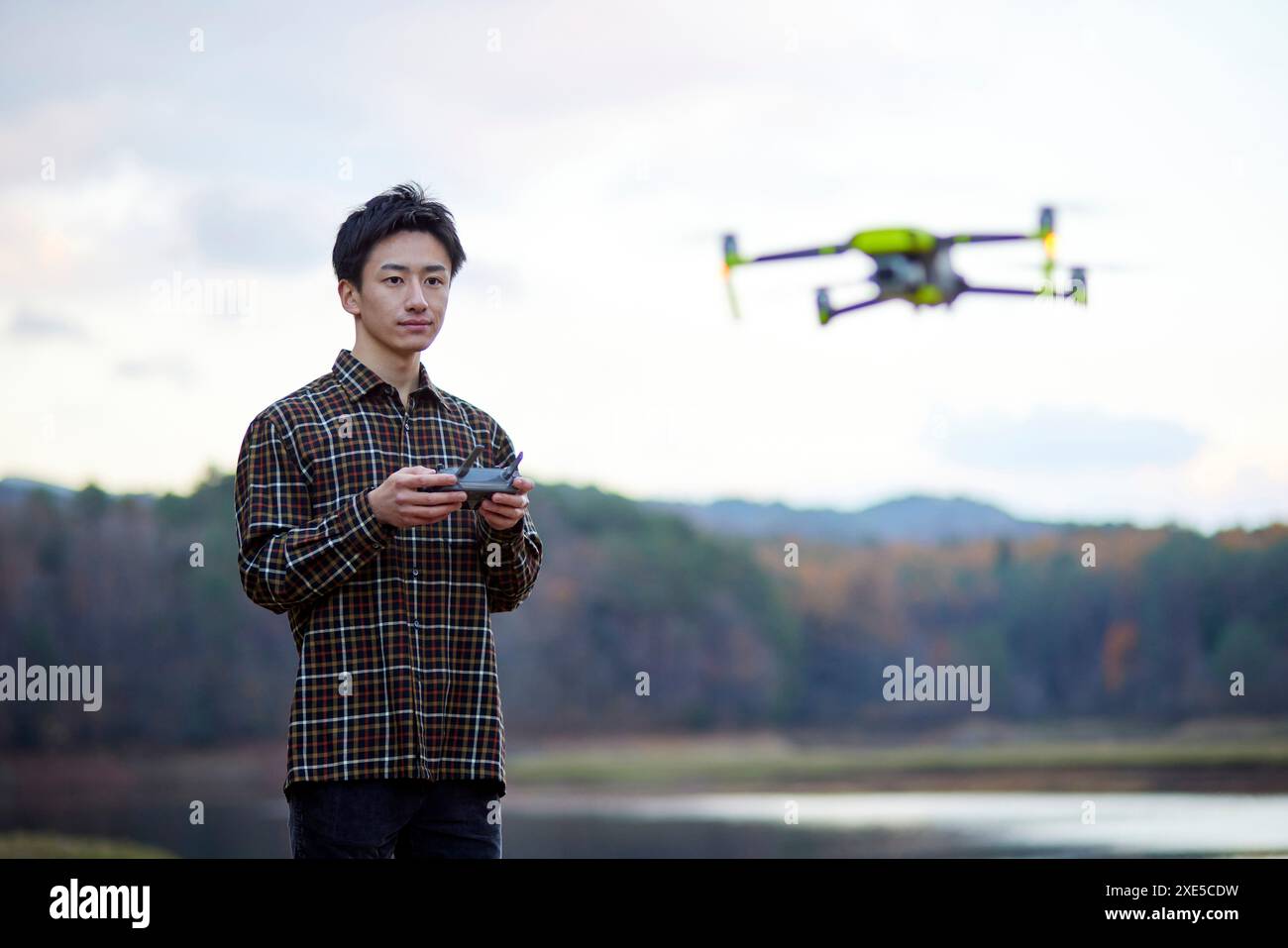 Young Japanese man operating a drone Stock Photo - Alamy