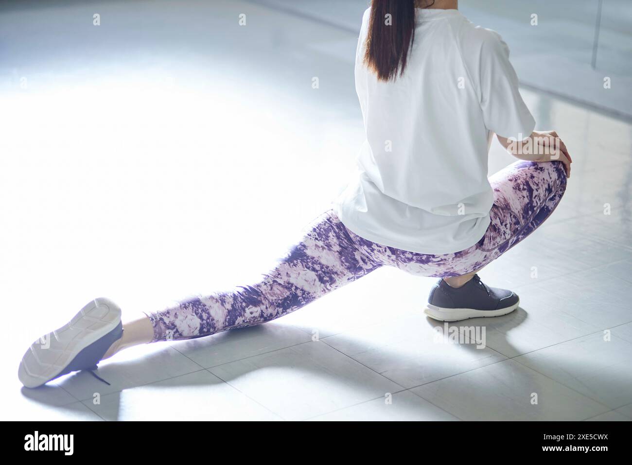 Young Japanese woman stretching Stock Photo - Alamy