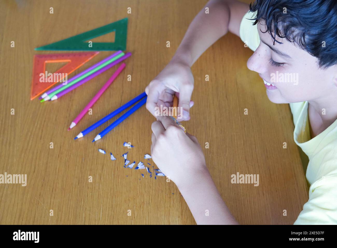 happy child sharpening his crayons, ready to go back to school Stock ...