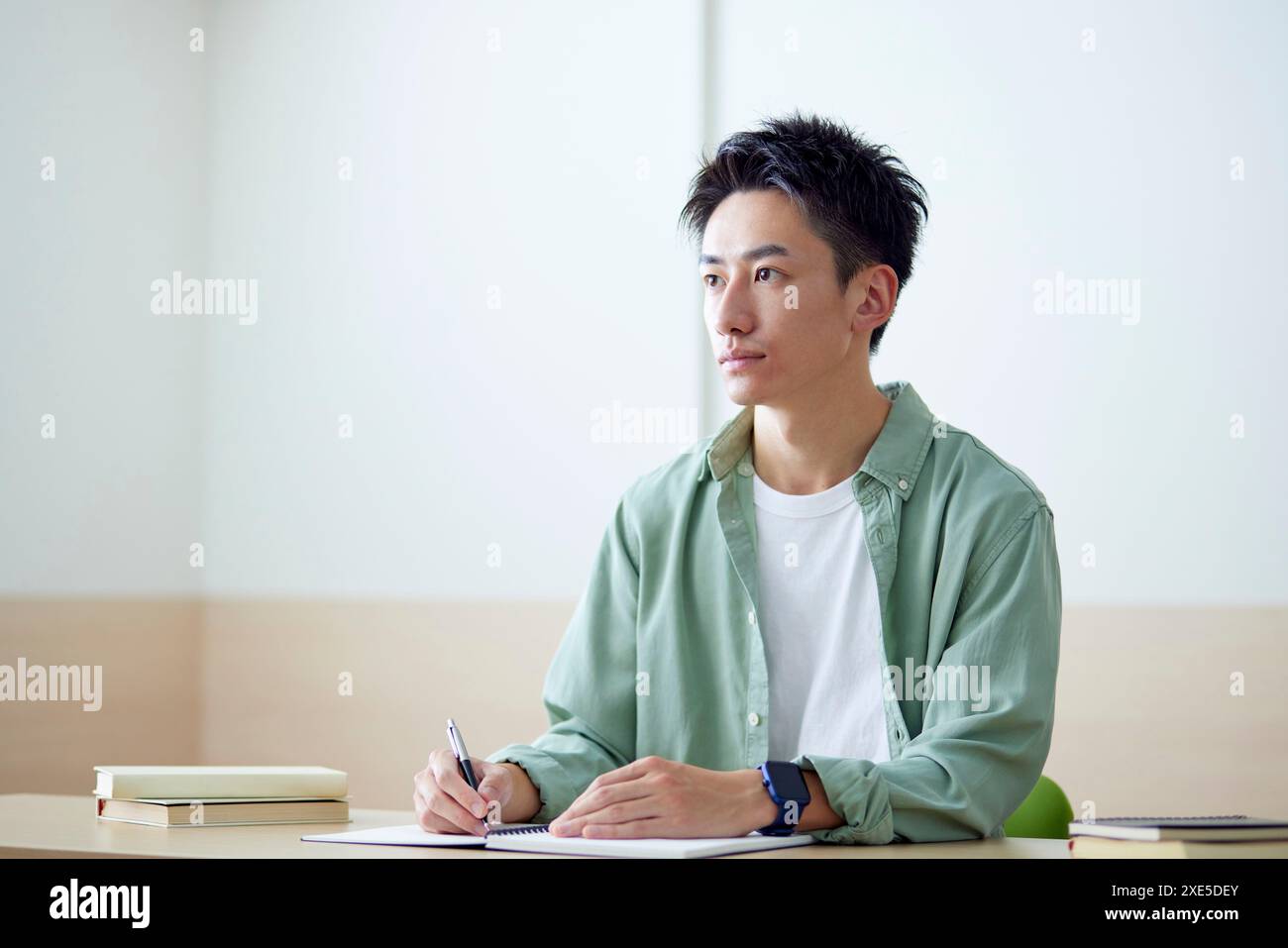Young Japanese student studying in classroom Stock Photo - Alamy