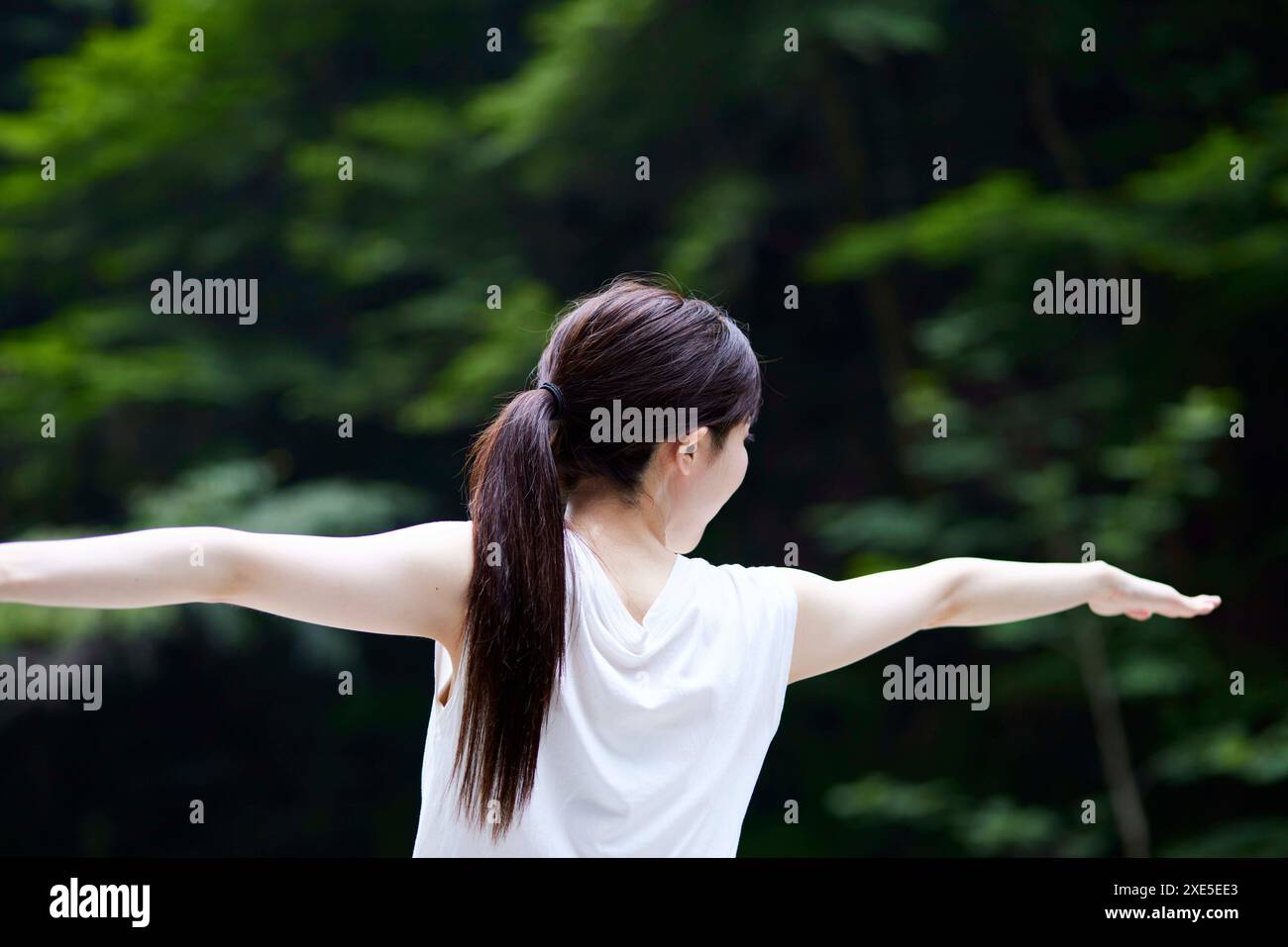 Japanese woman stretching in nature Stock Photo - Alamy