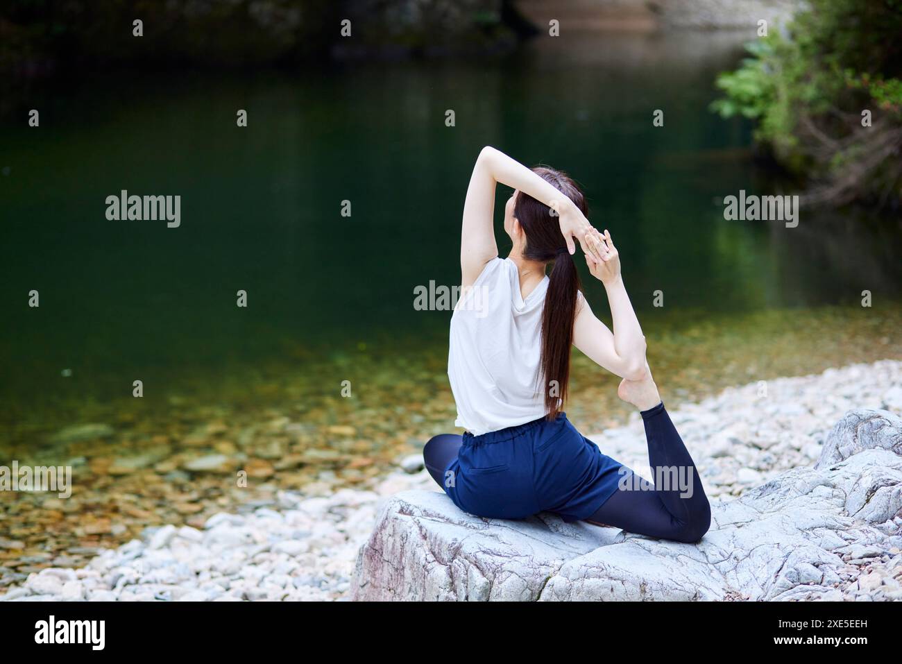 Japanese woman stretching in nature Stock Photo - Alamy