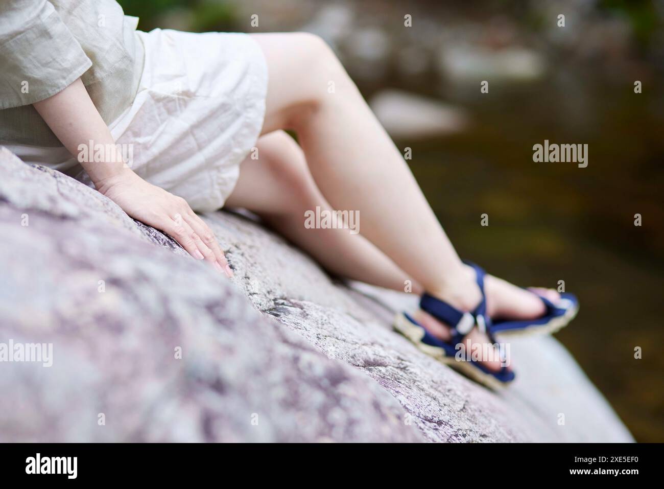 Japanese woman's feet relaxing in nature Stock Photo - Alamy