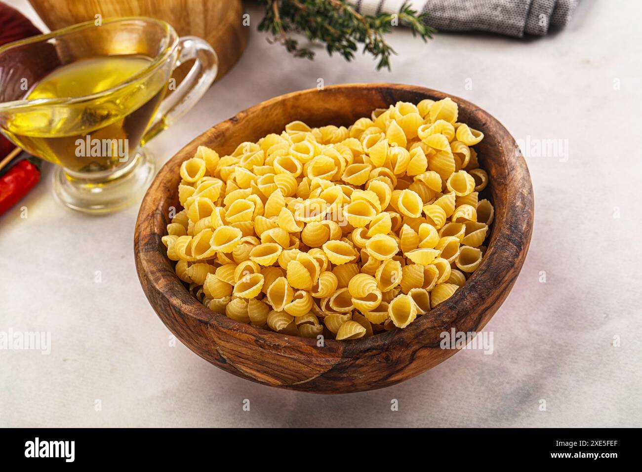 Italian cuisine - dry conchiglie shell pasta Stock Photo - Alamy