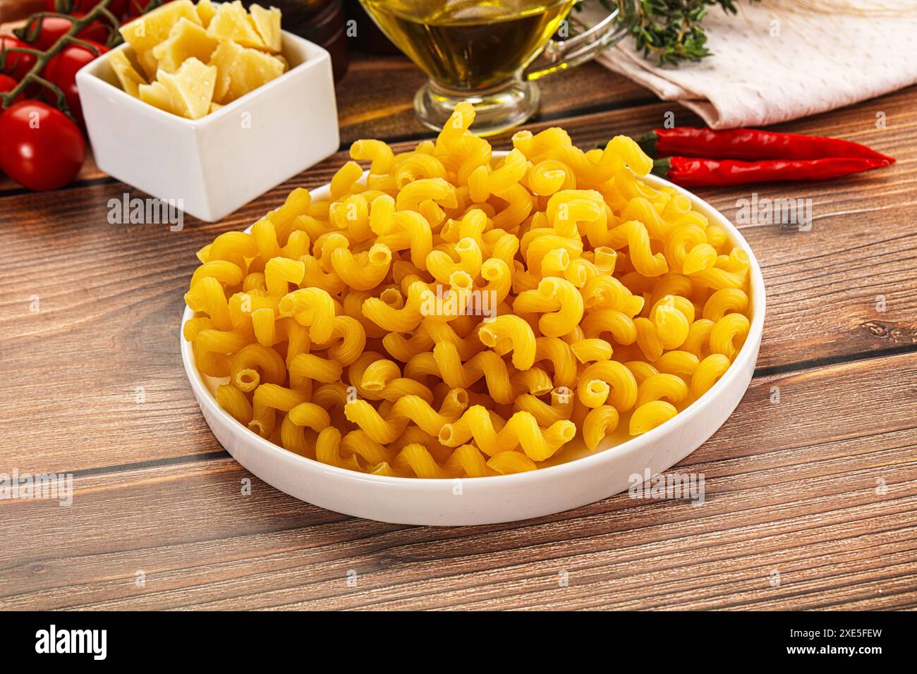 Italian cuisine - dry cellentani pasta for cooking Stock Photo - Alamy