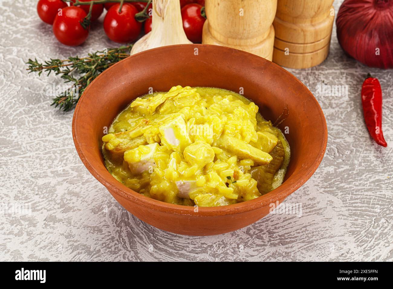 Italian cuisine - yellow risotto with chicken and soft cheese Stock ...