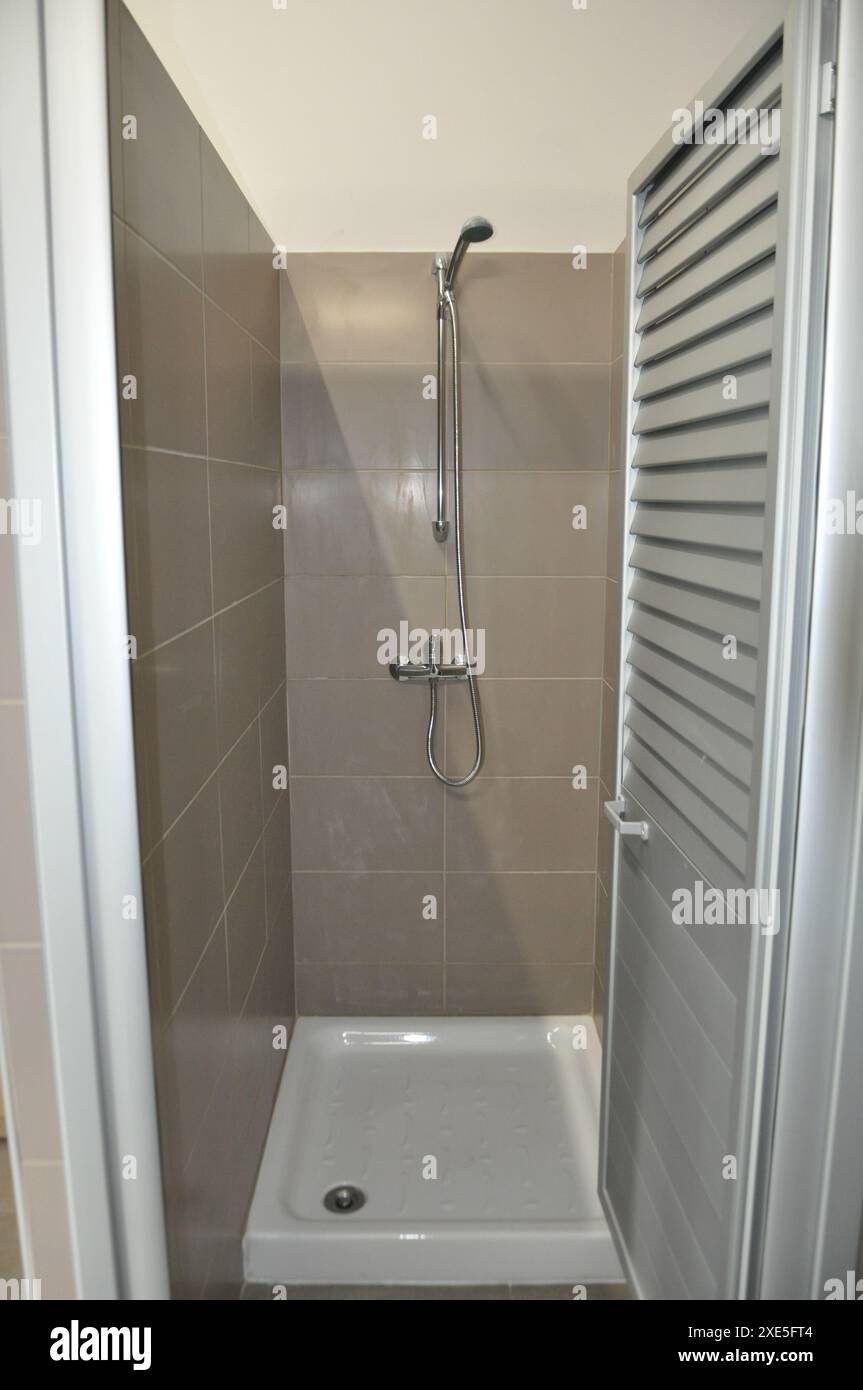 Restroom, wooden wardrobes, bench and shower rooms Stock Photo - Alamy