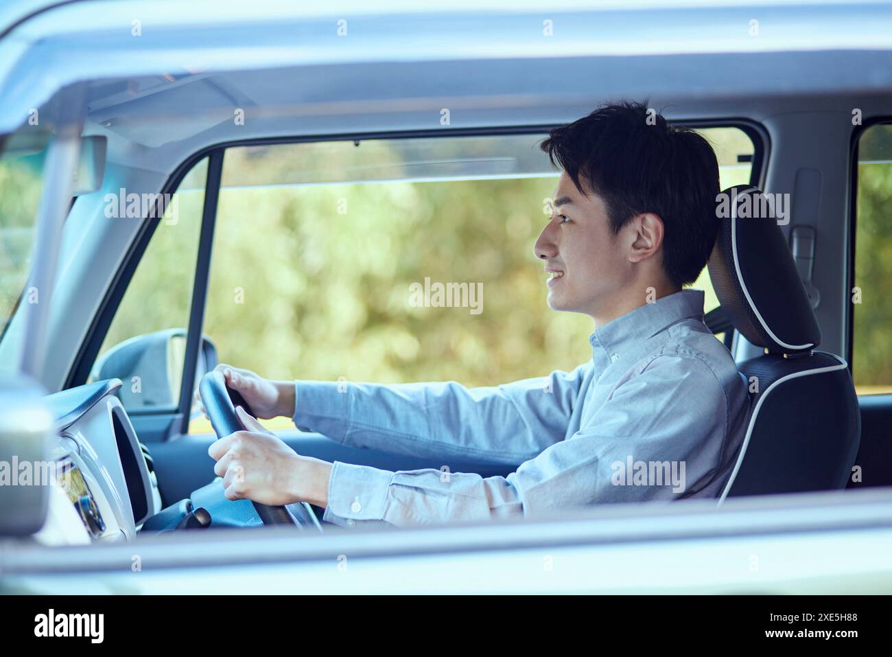 Asian male driving car hi-res stock photography and images - Alamy