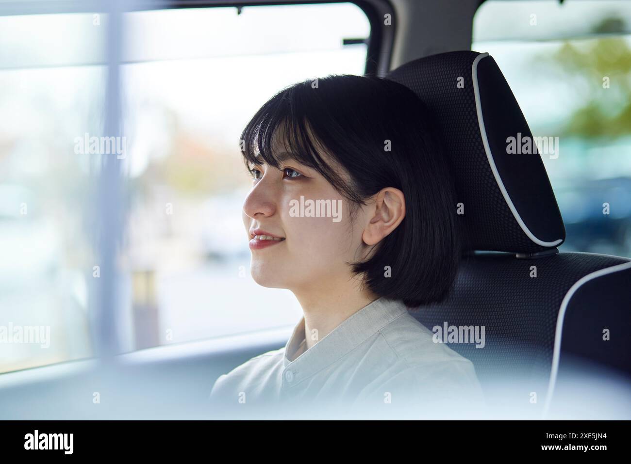 Young Japanese woman driving a car Stock Photo - Alamy