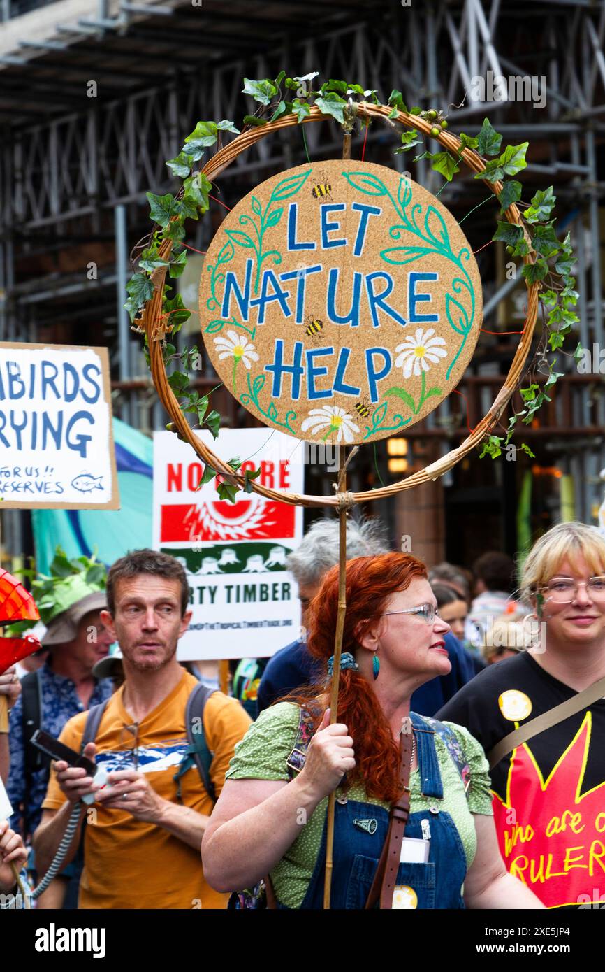 Placard, 'Let Nature Help, at the Restore Nature Now march. London, UK ...